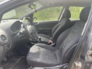 Grey Opel Corsa 2011 in Moletai, with an engine capacity of 1.23 L and mileage of 210 thousand km for 700 €, photo 6 on AUTOMOTO.COM.LV
