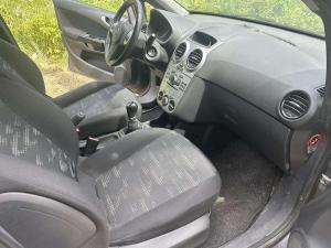 Grey Opel Corsa 2011 in Moletai, with an engine capacity of 1.23 L and mileage of 210 thousand km for 700 €, photo 8 on AUTOMOTO.COM.LV
