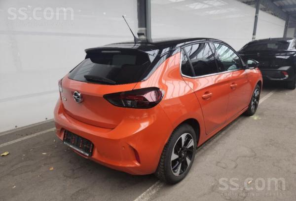 Orange Opel Corsa 2023 in Riga, with an engine capacity of 1.40 L and mileage of 61 thousand km for 16499 €, photo 5 on AUTOMOTO.COM.LV