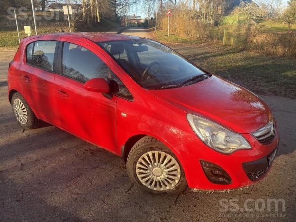 Red Opel Corsa 2011 in Riga, with an engine capacity of 1.30 L and mileage of 252 thousand km for 2200 €, photo 2 on AUTOMOTO.COM.LV
