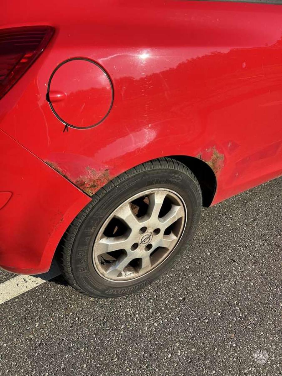 Red Opel Corsa 2008 in Vilnius, with an engine capacity of 1.00 L and mileage of 172 thousand km for 950 €, photo 5 on AUTOMOTO.COM.LV