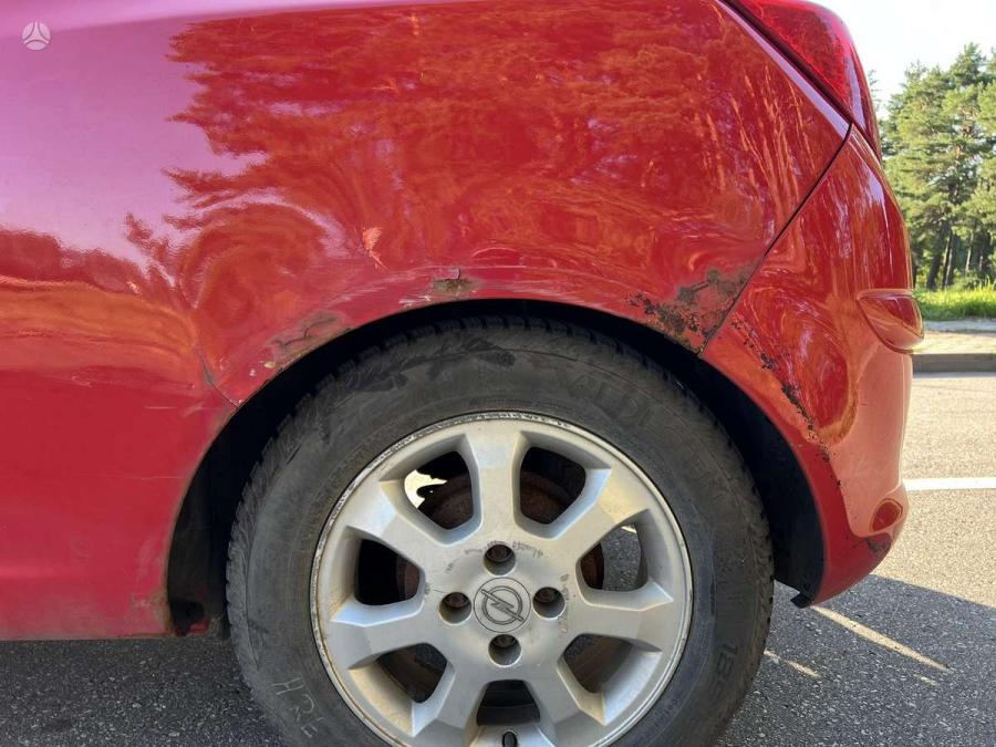 Red Opel Corsa 2008 in Vilnius, with an engine capacity of 1.00 L and mileage of 172 thousand km for 950 €, photo 11 on AUTOMOTO.COM.LV