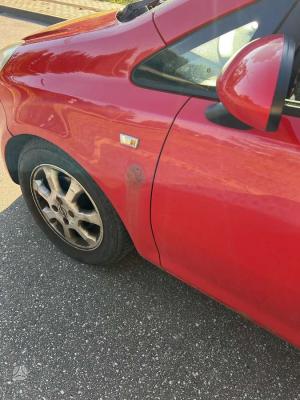 Red Opel Corsa 2008 in Vilnius, with an engine capacity of 1.00 L and mileage of 172 thousand km for 950 €, photo 12 on AUTOMOTO.COM.LV