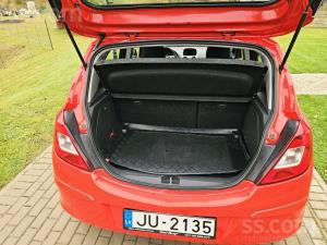 Red Opel Corsa 2014 in Riga, with an engine capacity of 1.30 L and mileage of 241 thousand km for 3400 €, photo 7 on AUTOMOTO.COM.LV