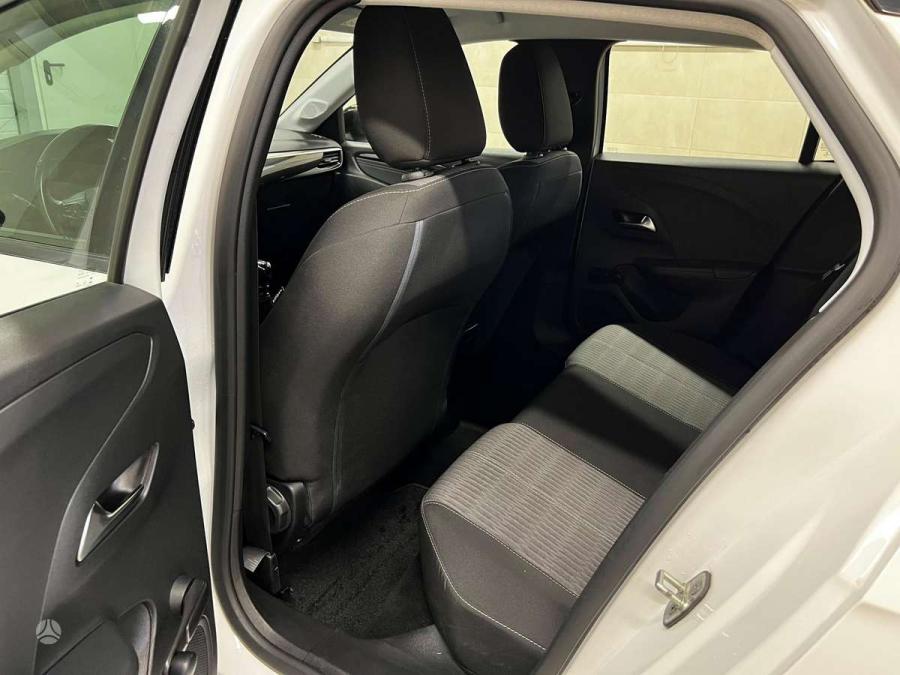 White Opel Corsa 2022 in Marijampole, with an engine capacity of 1.20 L and mileage of 109 thousand km for 7623 €, photo 15 on AUTOMOTO.COM.LV