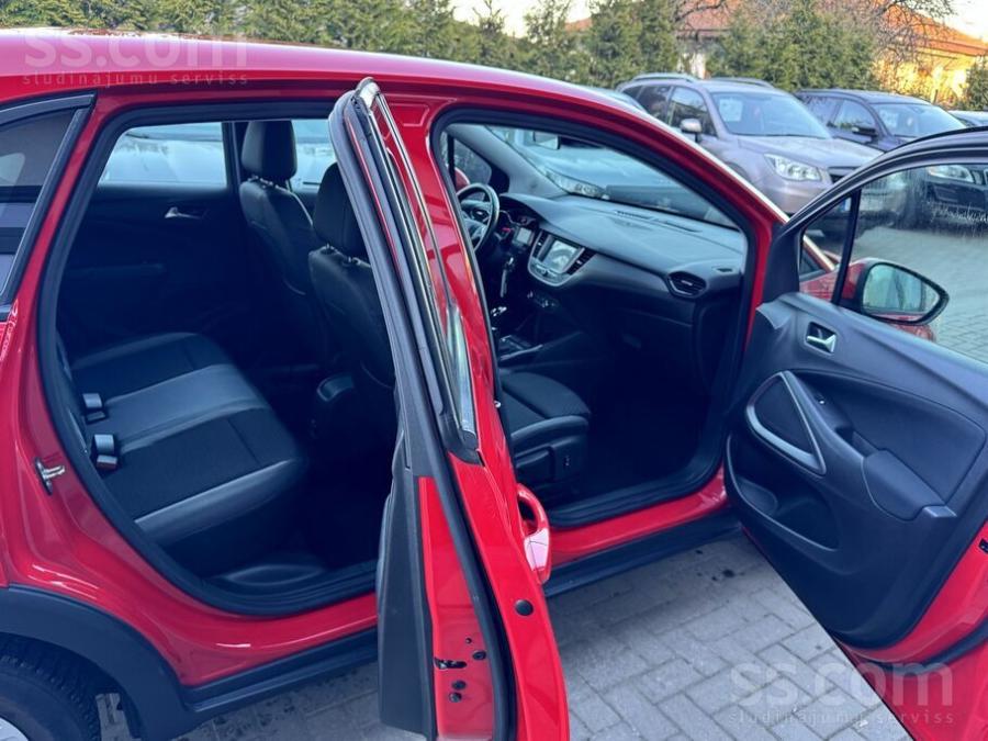Red Opel Crossland X 2018 in Riga, with an engine capacity of 1.20 L and mileage of 125 thousand km for 8300 €, photo 12 on AUTOMOTO.COM.LV