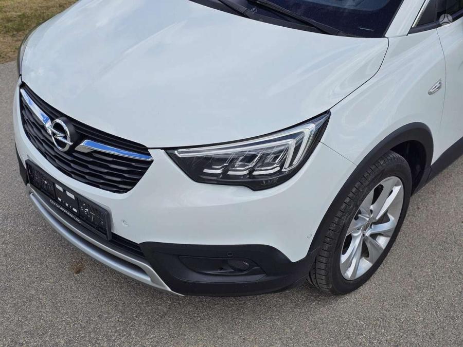 White Opel Crossland X 2019 in Rokiskis, with an engine capacity of 1.20 L and mileage of 103 thousand km for 9650 €, photo 3 on AUTOMOTO.COM.LV