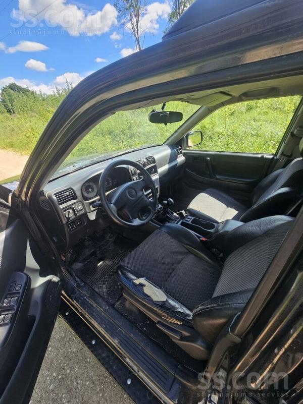 Black Opel Frontera 2002 in Aluksne, with an engine capacity of 2.20 L and mileage of 300 thousand km for 1250 €, photo 5 on AUTOMOTO.COM.LV