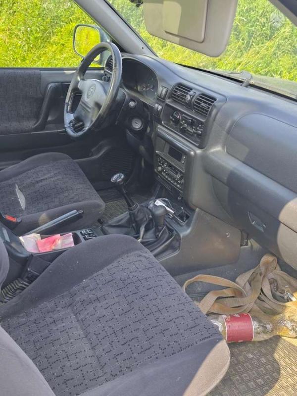 Green Opel Frontera 1999 in Prienai, with an engine capacity of 2.17 L and mileage of 254 thousand km for 450 €, photo 6 on AUTOMOTO.COM.LV