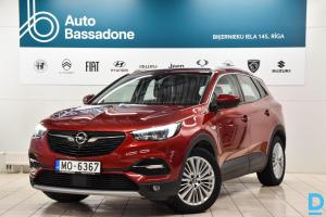 Red Opel Grandland X 2020 in Riga, with an engine capacity of 1.20 L and mileage of 92 thousand km for 15990 €, photo  on AUTOMOTO.COM.LV