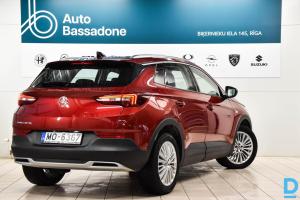 Red Opel Grandland X 2020 in Riga, with an engine capacity of 1.20 L and mileage of 92 thousand km for 15990 €, photo 3 on AUTOMOTO.COM.LV