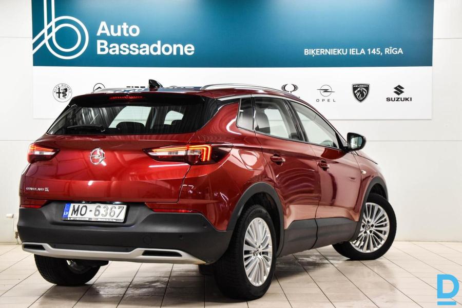 Red Opel Grandland X 2020 in Riga, with an engine capacity of 1.20 L and mileage of 92 thousand km for 15990 €, photo 3 on AUTOMOTO.COM.LV