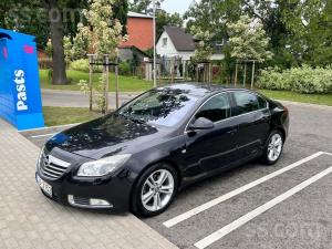 Black Opel Insignia 2009 in Riga, with an engine capacity of 2.00 L and mileage of 283 thousand km for 1300 €, photo 5 on AUTOMOTO.COM.LV