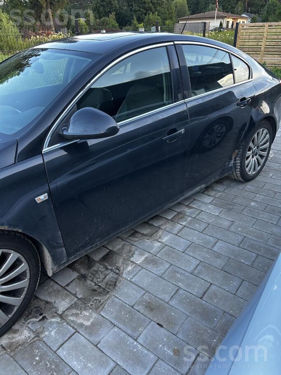 Black Opel Insignia 2010 in Riga, with an engine capacity of 2.00 L and mileage of 256 thousand km for 1600 €, photo 19 on AUTOMOTO.COM.LV