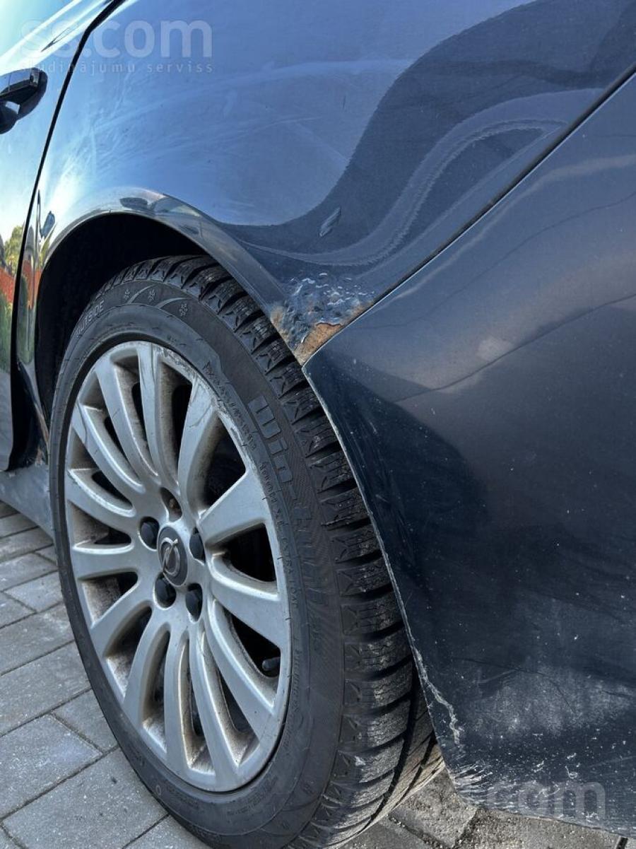 Black Opel Insignia 2010 in Riga, with an engine capacity of 2.00 L and mileage of 256 thousand km for 1600 €, photo 32 on AUTOMOTO.COM.LV