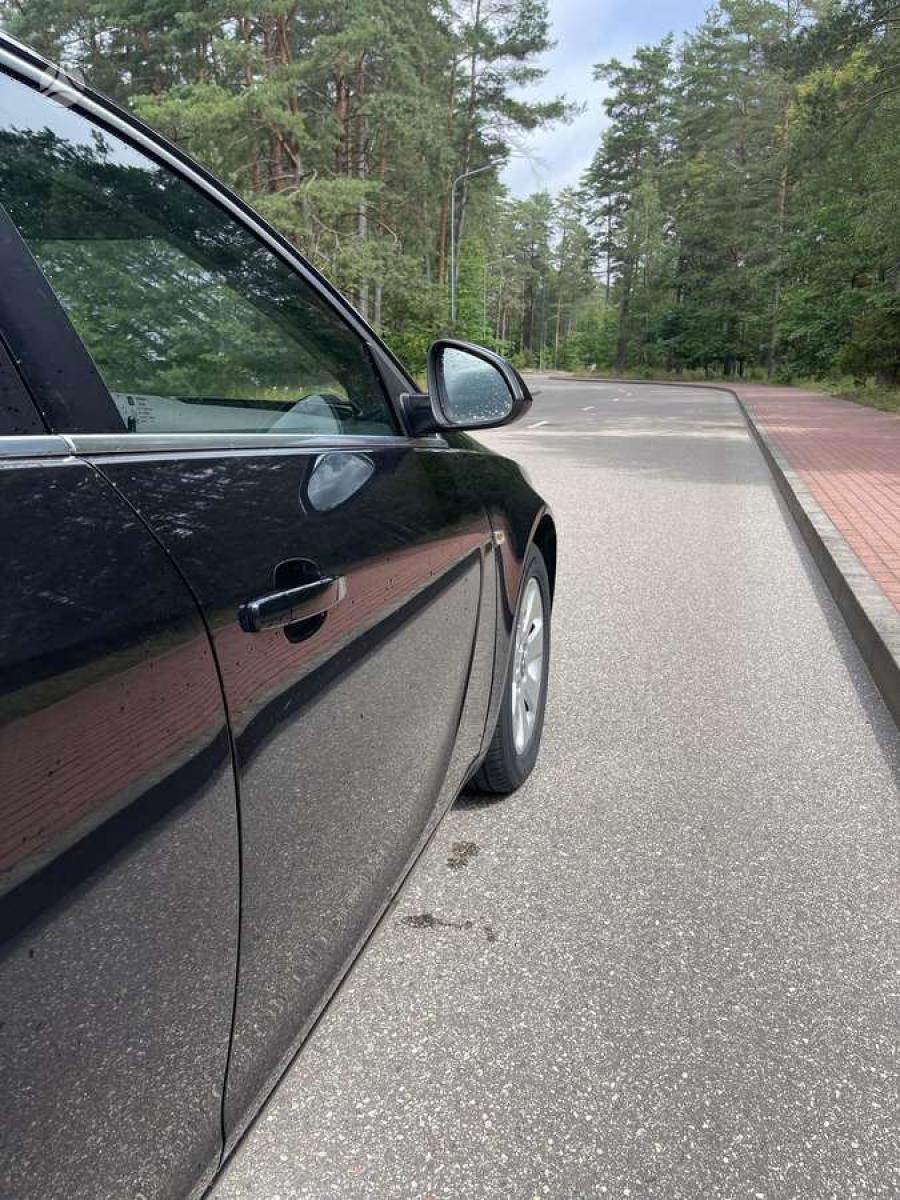 Black Opel Insignia 2009 in Druskininkai, with an engine capacity of 1.96 L and mileage of 233 thousand km for 2990 €, photo 15 on AUTOMOTO.COM.LV