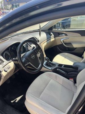 Black Opel Insignia 2012 in Kaunas, with an engine capacity of 2.00 L and mileage of 300 thousand km for 2990 €, photo 9 on AUTOMOTO.COM.LV