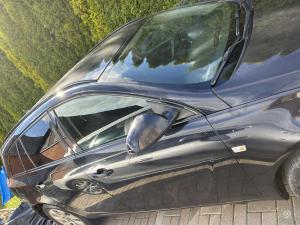 Black Opel Insignia 2009 in Kelme, with an engine capacity of 1.96 L and mileage of 247 thousand km for 1799 €, photo 6 on AUTOMOTO.COM.LV
