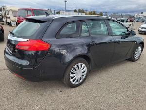 Black Opel Insignia 2010 in Marijampole, with an engine capacity of 2.00 L and mileage of 198 thousand km for 2750 €, photo 12 on AUTOMOTO.COM.LV