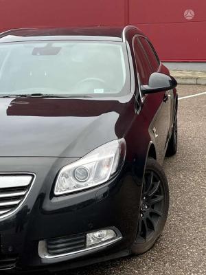 Black Opel Insignia 2011 in Kaunas, with an engine capacity of 1.96 L and mileage of 253 thousand km for 2950 €, photo 20 on AUTOMOTO.COM.LV