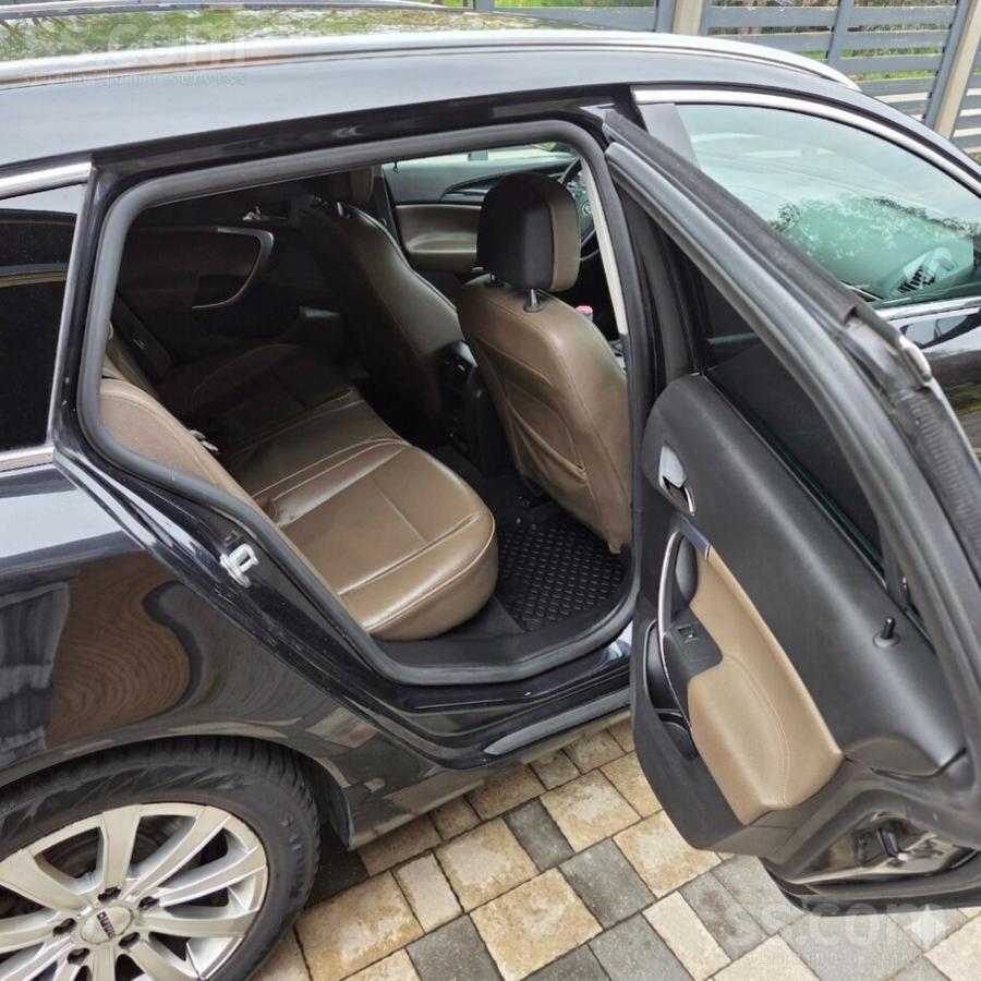 Black Opel Insignia 2013 in Riga, with an engine capacity of 2.00 L and mileage of 174 thousand km for 7300 €, photo 12 on AUTOMOTO.COM.LV