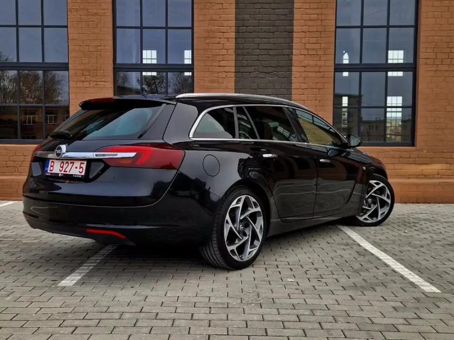 Black Opel Insignia 2013 in Riga, with an engine capacity of 2.00 L and mileage of 203 thousand km for 6390 €, photo 3 on AUTOMOTO.COM.LV
