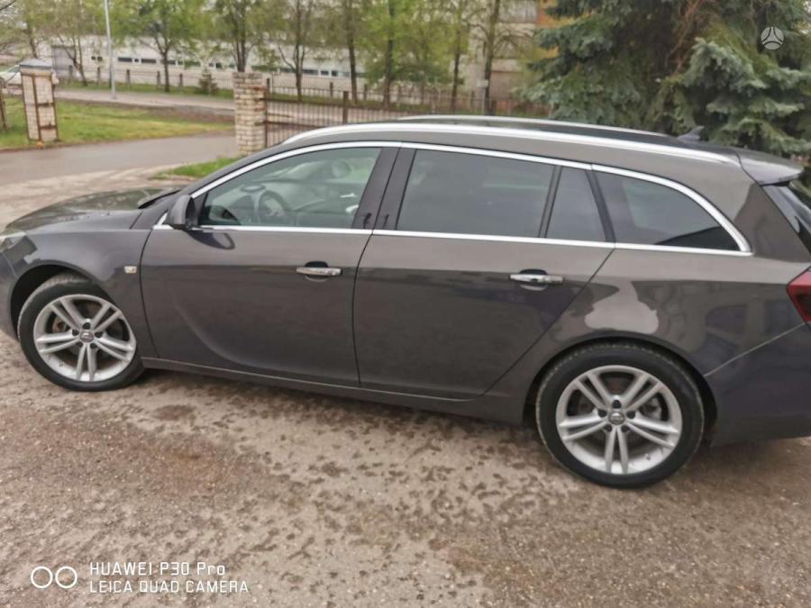 Brown Opel Insignia 2015 in Prienai, with an engine capacity of 1.96 L and mileage of 221 thousand km for 5799 €, photo 12 on AUTOMOTO.COM.LV