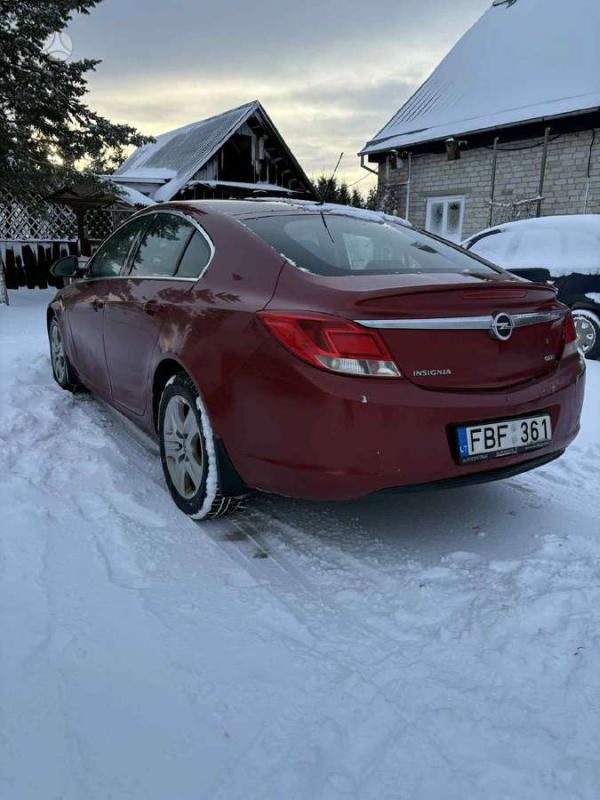Red Opel Insignia 2010 in Klaipeda, with an engine capacity of 1.96 L and mileage of 280 thousand km for 2000 €, photo 3 on AUTOMOTO.COM.LV