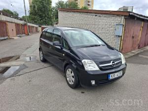 Black Opel Meriva 2005 in Riga, with an engine capacity of 1.60 L and mileage of 236 thousand km for 1559 €, photo 3 on AUTOMOTO.COM.LV