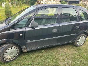 Black Opel Meriva 2005 in Daugavpils, with an engine capacity of 1.60 L and mileage of 323 thousand km for 800 €, photo  on AUTOMOTO.COM.LV