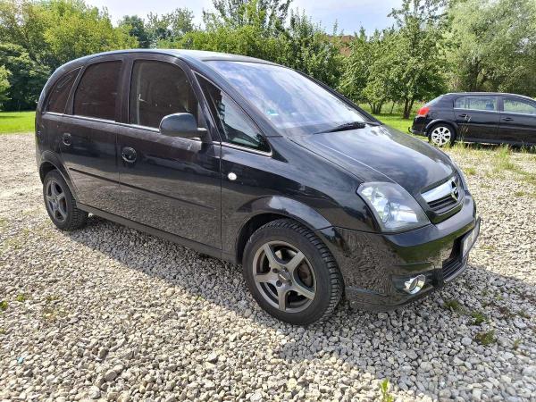 Black Opel Meriva 2009 in Siauliai, with an engine capacity of 1.80 L and mileage of 215 thousand km for 2000 €, photo 1 on AUTOMOTO.COM.LV
