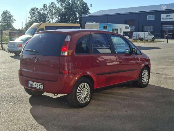 Red Opel Meriva 2005 in Plunge, with an engine capacity of 1.36 L and mileage of 125 thousand km for 850 €, photo 5 on AUTOMOTO.COM.LV