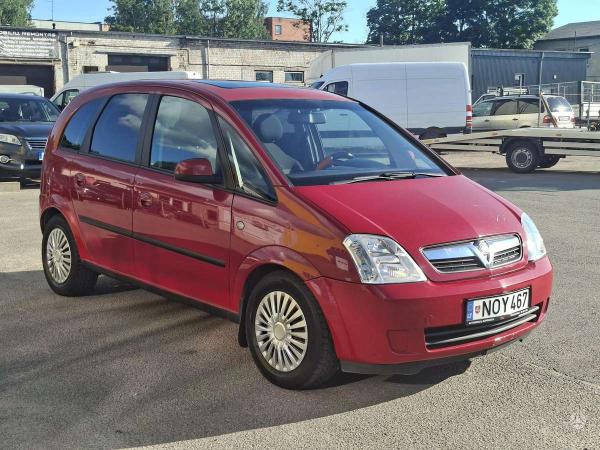 Red Opel Meriva 2005 in Plunge, with an engine capacity of 1.36 L and mileage of 125 thousand km for 850 €, photo 7 on AUTOMOTO.COM.LV
