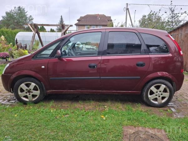 Red Opel Meriva 2005 in Bauska, with an engine capacity of 1.70 L and mileage of 226 thousand km for 700 €, photo 1 on AUTOMOTO.COM.LV