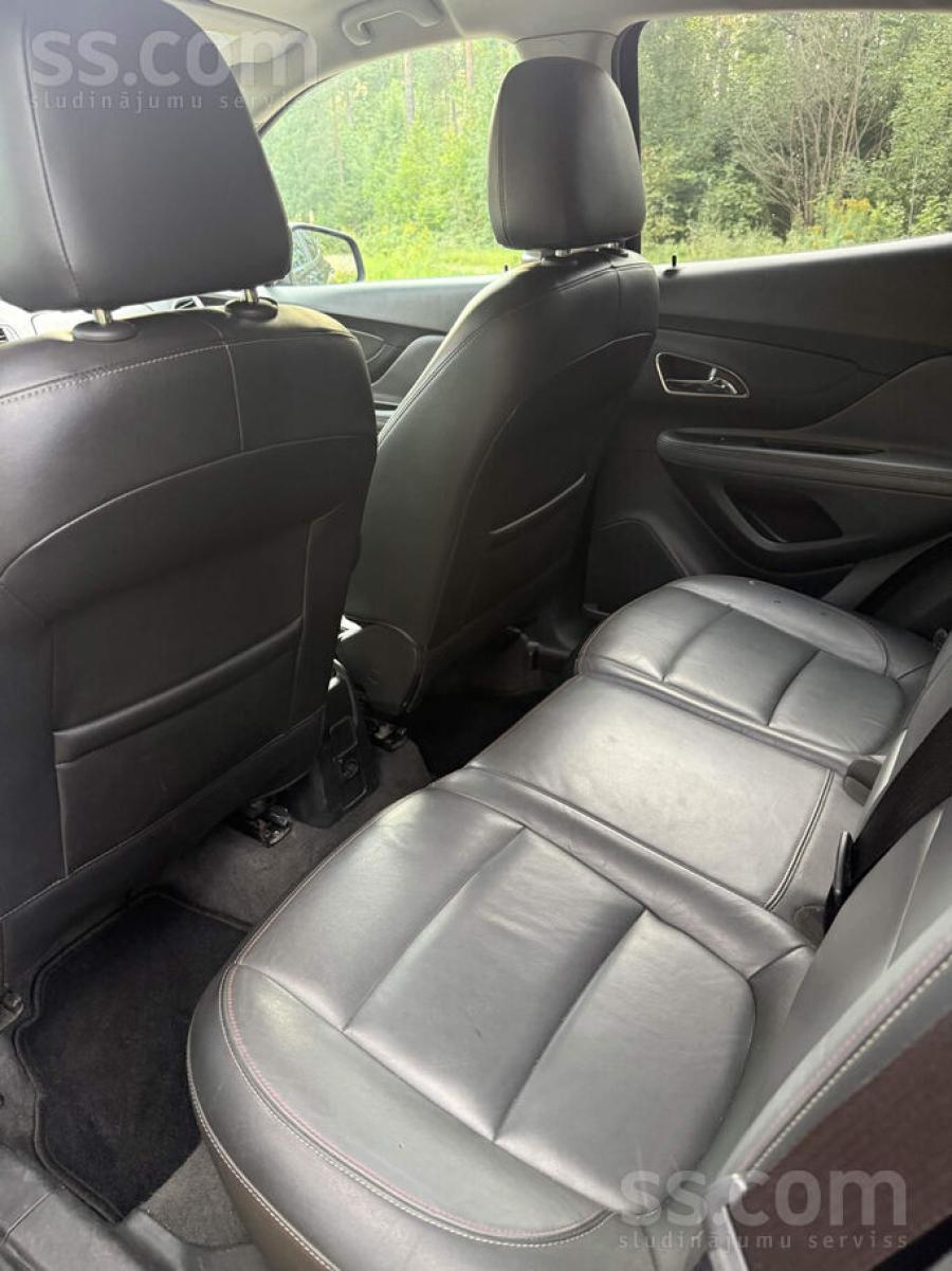 Black Opel Mokka 2013 in Riga, with an engine capacity of 1.70 L and mileage of 242 thousand km for 7100 €, photo 9 on AUTOMOTO.COM.LV