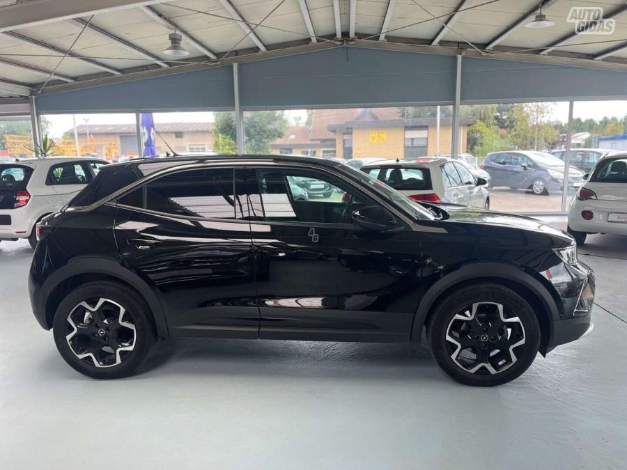 Black Opel Mokka 2021 in Kaunas, with an engine capacity of 1.20 L and mileage of 27 thousand km for 21834 €, photo 4 on AUTOMOTO.COM.LV