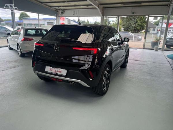 Black Opel Mokka 2021 in Kaunas, with an engine capacity of 1.20 L and mileage of 27 thousand km for 21834 €, photo 5 on AUTOMOTO.COM.LV