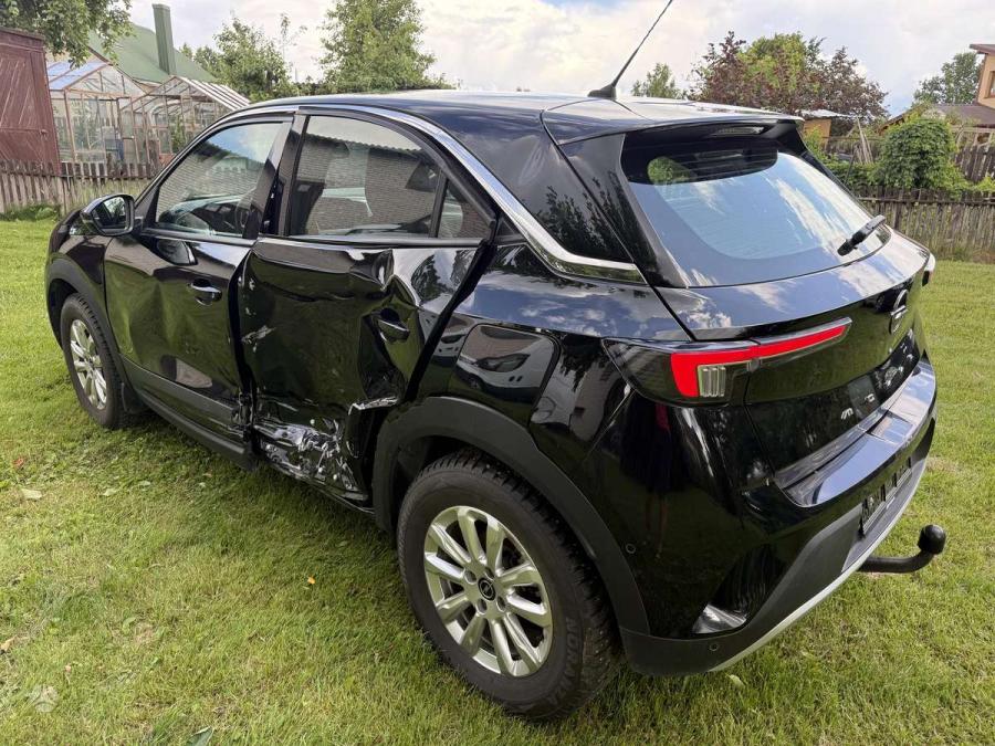 Black Opel Mokka 2021 in Panevezys, with an engine capacity of 1.20 L and mileage of 95 thousand km for 7600 €, photo 6 on AUTOMOTO.COM.LV