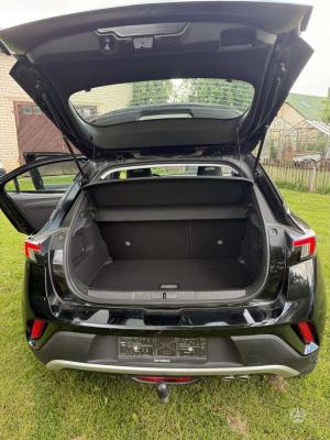 Black Opel Mokka 2021 in Panevezys, with an engine capacity of 1.20 L and mileage of 95 thousand km for 7600 €, photo 14 on AUTOMOTO.COM.LV