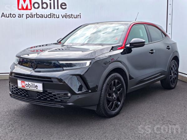 Black Opel Mokka 2022 in Riga, with an engine capacity of 1.20 L and mileage of 81 thousand km for 15900 €, photo 4 on AUTOMOTO.COM.LV