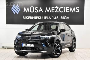 Black Opel Mokka 2022 in Riga, with an engine capacity of 1.20 L and mileage of 24 thousand km for 17990 €, photo  on AUTOMOTO.COM.LV