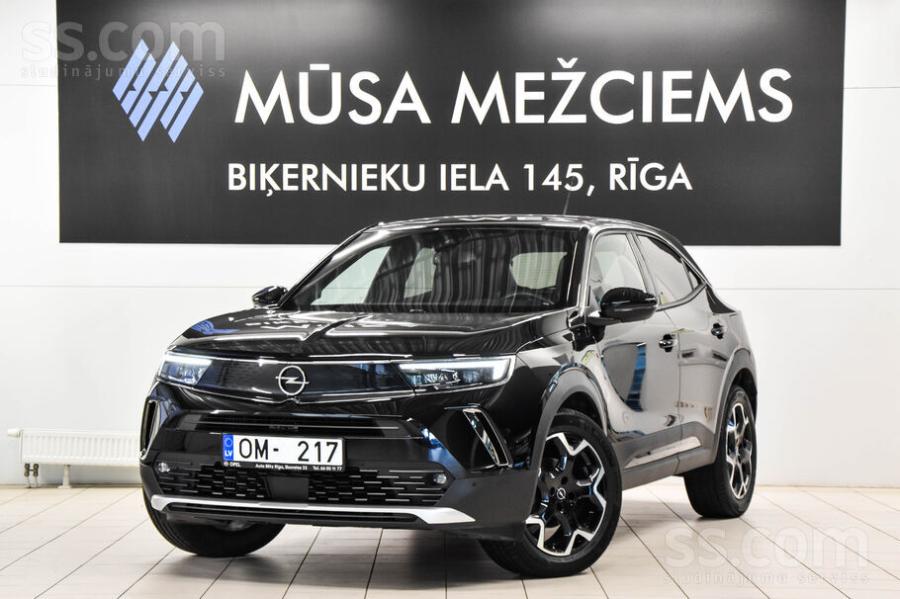 Black Opel Mokka 2022 in Riga, with an engine capacity of 1.20 L and mileage of 24 thousand km for 17990 €, photo 1 on AUTOMOTO.COM.LV