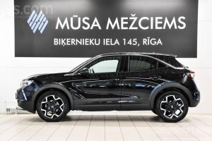 Black Opel Mokka 2022 in Riga, with an engine capacity of 1.20 L and mileage of 24 thousand km for 17990 €, photo 6 on AUTOMOTO.COM.LV