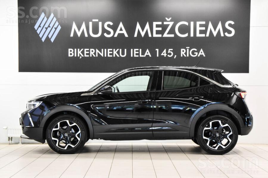 Black Opel Mokka 2022 in Riga, with an engine capacity of 1.20 L and mileage of 24 thousand km for 17990 €, photo 6 on AUTOMOTO.COM.LV