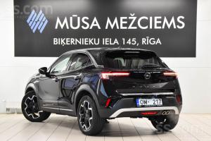 Black Opel Mokka 2022 in Riga, with an engine capacity of 1.20 L and mileage of 24 thousand km for 17990 €, photo 7 on AUTOMOTO.COM.LV