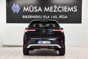 Black Opel Mokka 2022 in Riga, with an engine capacity of 1.20 L and mileage of 24 thousand km for 17990 €, photo 8 on AUTOMOTO.COM.LV