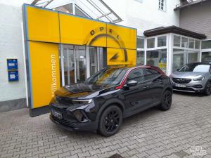 Black Opel Mokka 2023 in Kaunas, with an engine capacity of 1.20 L and mileage of 23 thousand km for 22379 €, photo  on AUTOMOTO.COM.LV