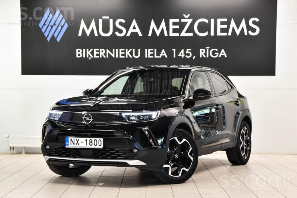 Black Opel Mokka 2023 in Riga, with an engine capacity of 1.20 L and mileage of 24 thousand km for 19990 €, photo 1 on AUTOMOTO.COM.LV