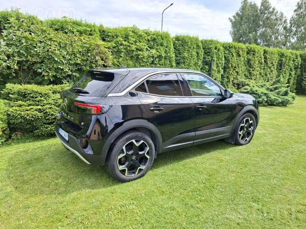 Black Opel Mokka 2022 in Riga, with an engine capacity of 1.60 L and mileage of 70 thousand km for 18200 €, photo 4 on AUTOMOTO.COM.LV