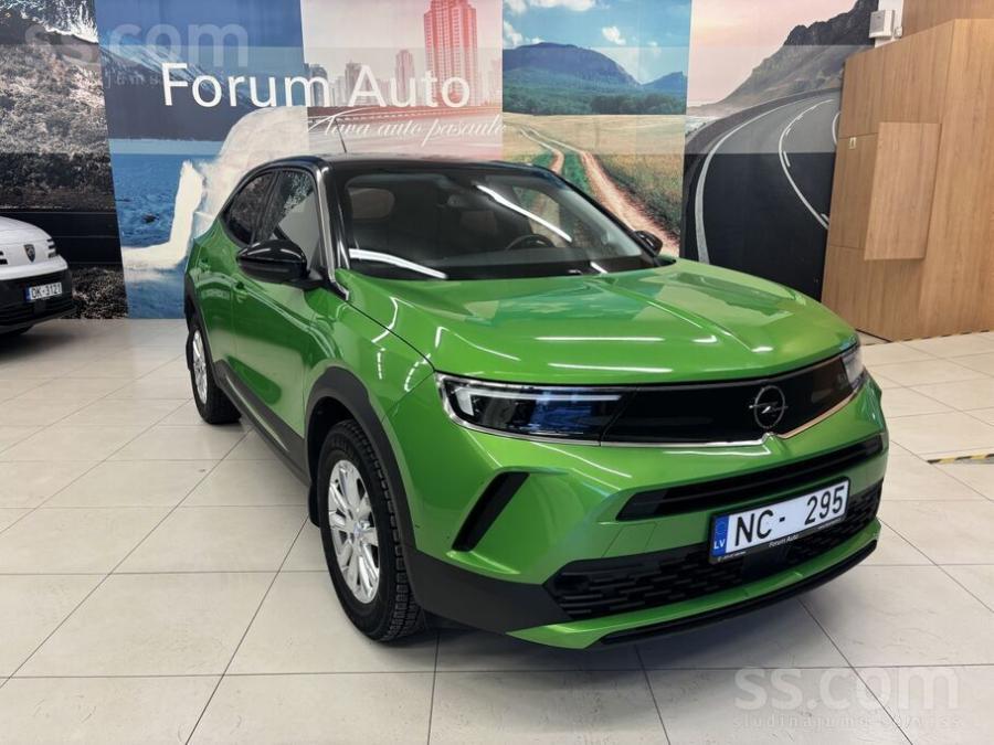 Green Opel Mokka 2022 in Riga, with an engine capacity of 1.20 L and mileage of 59 thousand km for 14700 €, photo 1 on AUTOMOTO.COM.LV